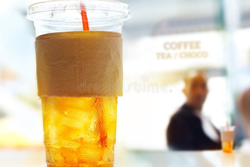 Lemon Ice Tea in Plastic Glasses on Restaurant Background Stock Photo ...