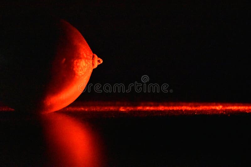 Lemon Iluminated by a Red Light Stock Photo - Image of iluminated ...