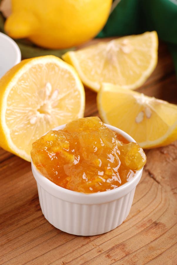 Lemon jam on wooden table stock image. Image of spoon - 25781671