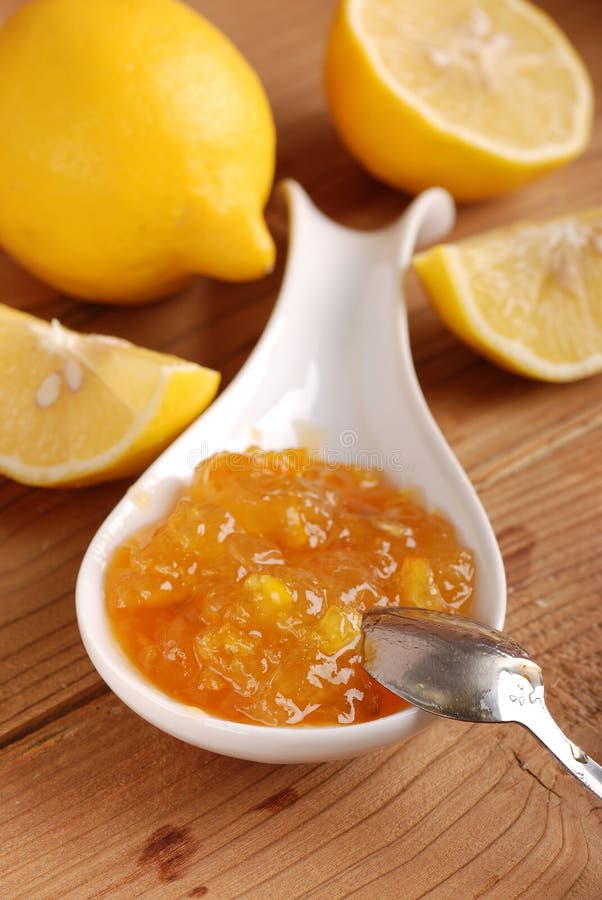 Lemon jam on wooden table stock image. Image of food - 25781711