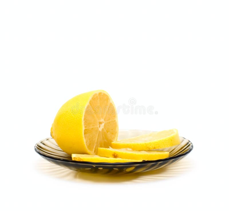 Lemon and Lemon Slices on Plate Stock Photo - Image of dessert, sunny ...
