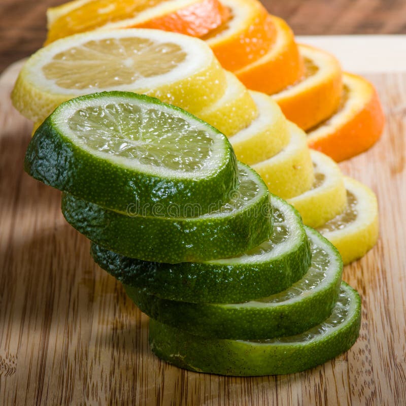 Lemon, Lime and Orange Slices Stock Photo - Image of ripe, board: 51464972
