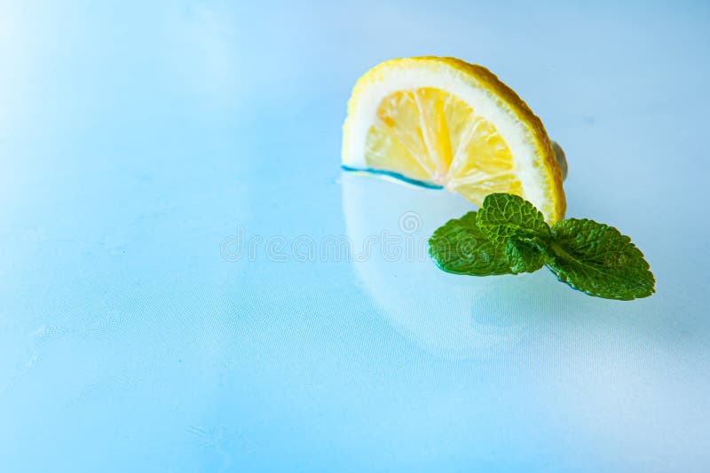 Lemon and Mint on a Blue Background Stock Photo - Image of fresh ...