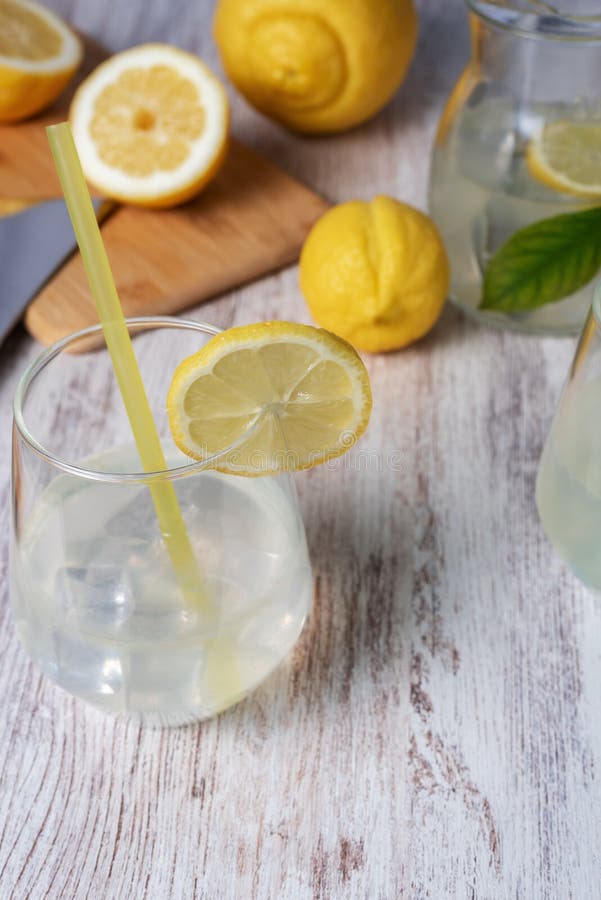 Lemon Next To Some Glasses with Straws and a Pitcher Stock Image ...