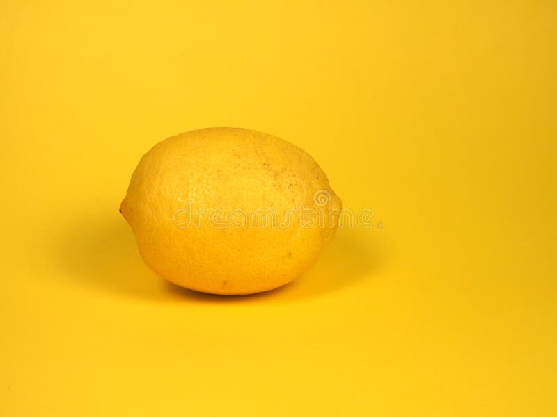 Lemon over yellow stock image. Image of space, lemon - 275419043
