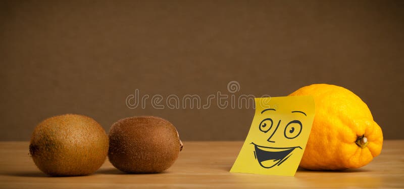 Lemon with Post-it Note Smiling at Kiwis Stock Image - Image of gesture ...