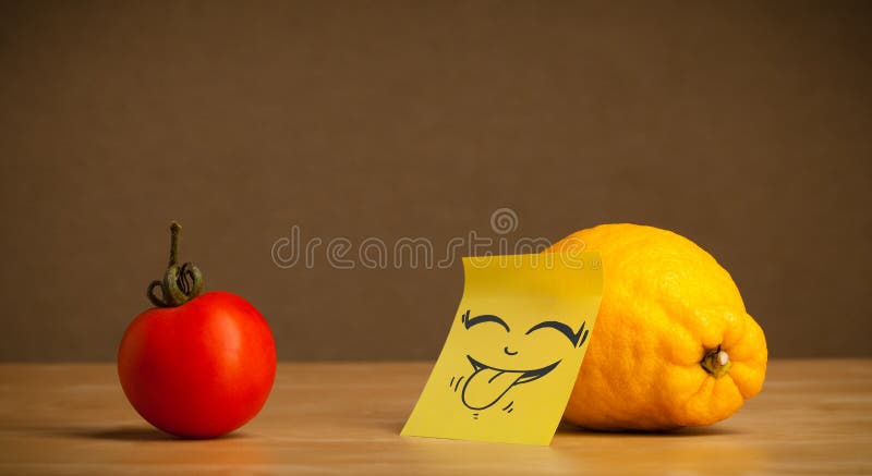 Lemon with Post-it Note Sticking Out Tongue To Tomato Stock Photo ...