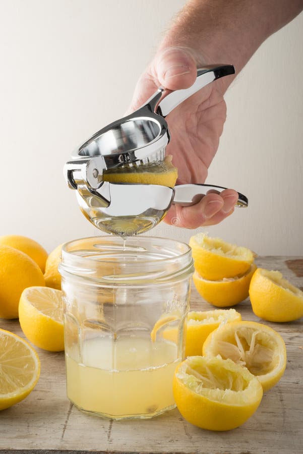 Lemon Press Squeezing a Lemon Stock Photo - Image of drink, press: 68654194