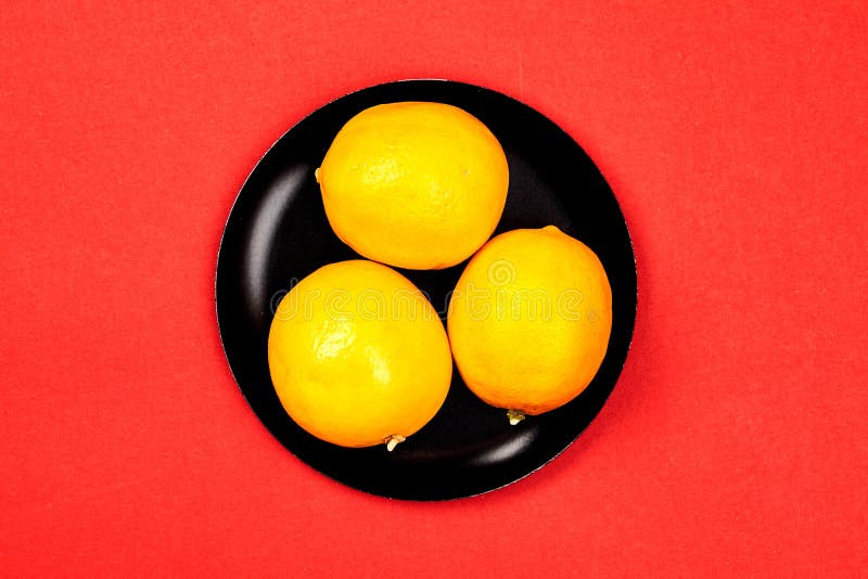 Lemon on red background. stock image. Image of fresh - 141088949