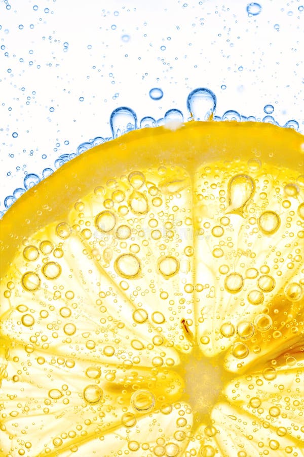 Lemon slice in clear water stock image. Image of flowing - 25629291