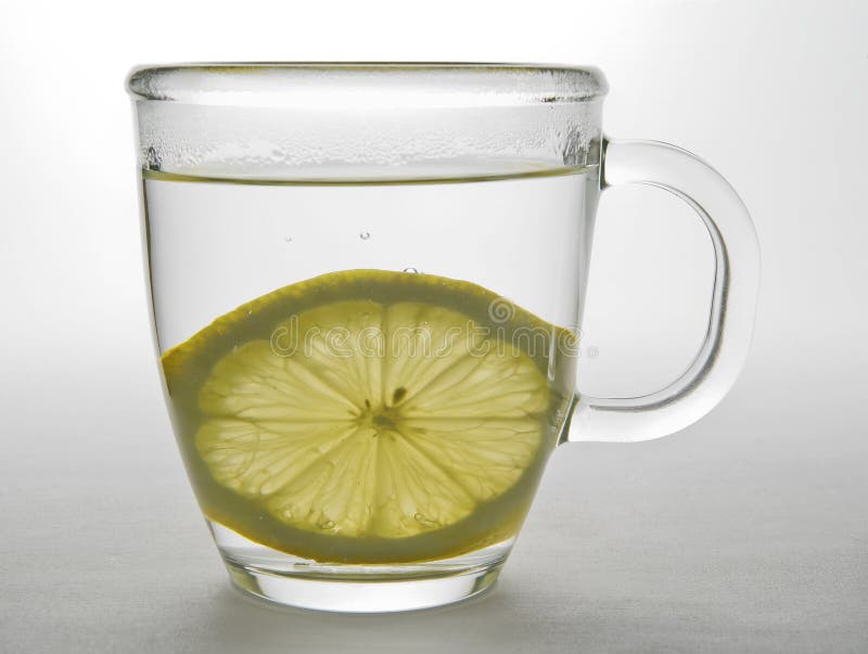 Lemon Slice in Glass Mug 2 stock image. Image of royalty - 10996893