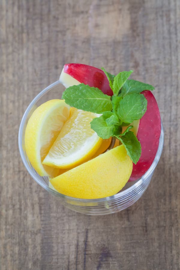 Lemon Slice and Red Apple Slice in Cup of Glass Stock Photo - Image of ...