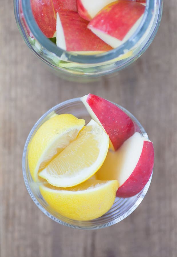 Lemon Slice and Red Apple Slice in Cup of Glass Stock Photo - Image of ...