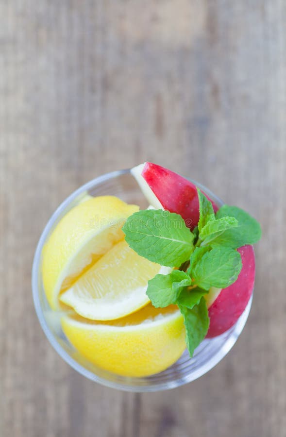 Lemon Slice and Red Apple Slice in Cup of Glass Stock Image - Image of ...