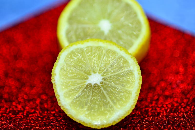 Lemon Slice on a Red Shiny Enamelled Plate Stock Image - Image of lemon ...