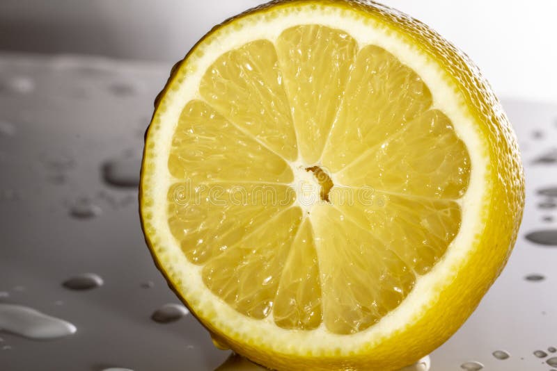 Lemon Slice on White Plastic Surfaces, Covered with Drops of Water ...