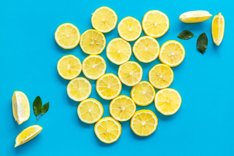 Lemon Slices and Leaves Pattern on Blue Background Top View Stock Photo ...