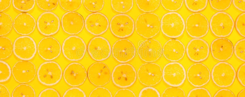 Lemon Slices in Straight Vertical Lines on Yellow Background, Flat Lay ...