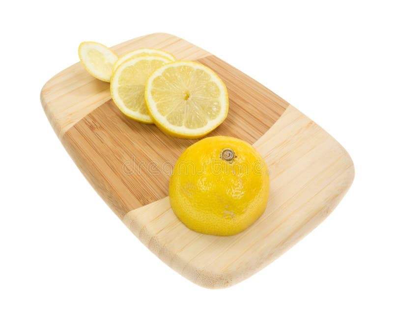 Lemon with Slices on Wood Cutting Board Stock Image - Image of board ...