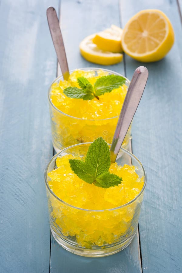 Lemon Slushie in Glass on Blue Wood Stock Image - Image of takeaway ...