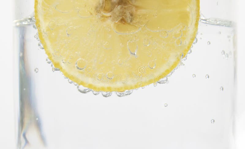 Lemon in sparkling water stock photo. Image of sparkling - 12753928