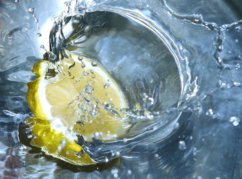 Lemon splashing water stock photo. Image of citron, pour - 658166