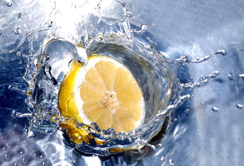 Lemon splashing water stock photo. Image of alcohol, yellow - 658186