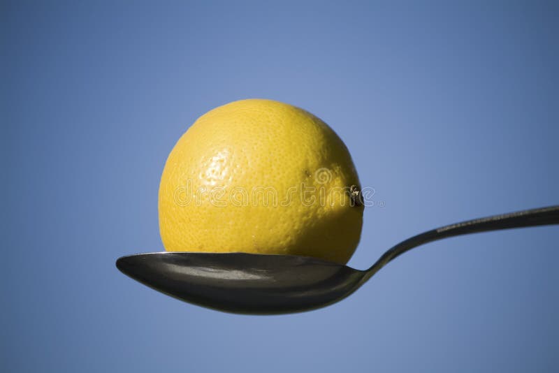 Lemon and spoon stock photo. Image of blue, fruit, spoon - 5732674