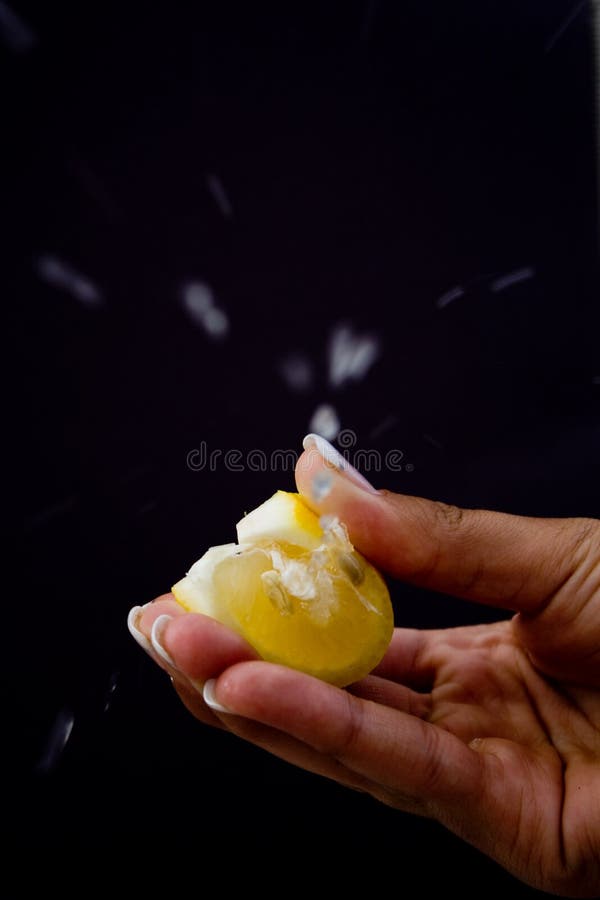 Lemon Squeeze stock photo. Image of drink, hand, liquid - 9471210