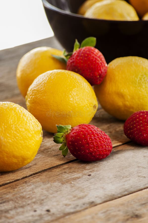 Lemon and strawberries stock image. Image of lemon, wood - 88128465
