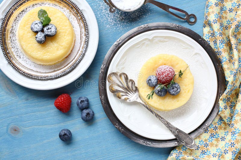 Lemon Surprise Pudding Cake Served with Berries Stock Image - Image of ...