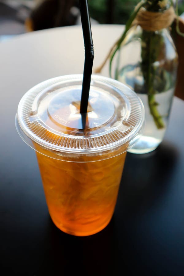 Lemon tea or mango tea stock image. Image of plastic - 207839095