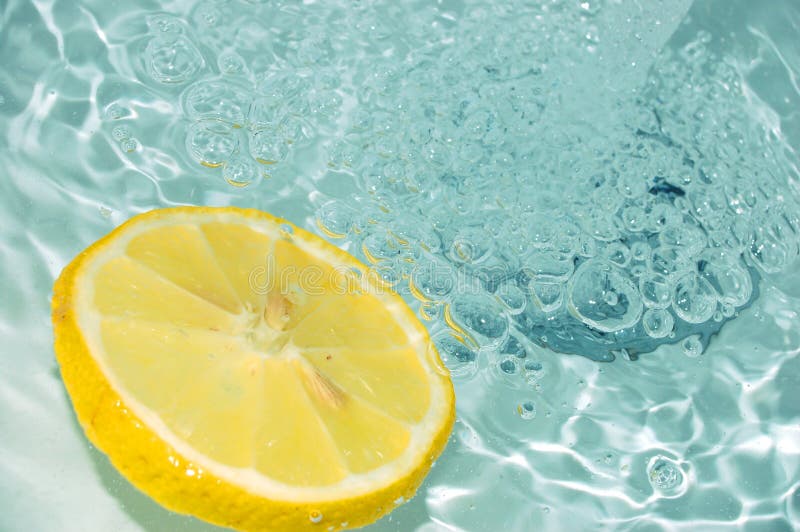 Lemon in water #2 stock photo. Image of flowing, elixir - 630146