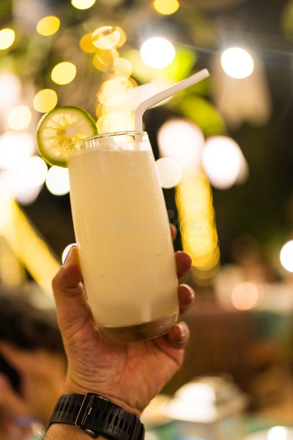 Lemon Water, Cold Blended with a Slice of Lemon on Top and a White ...