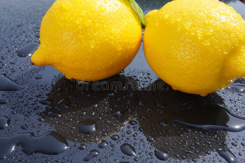 Lemon with Water Drops in a Nature Background Stock Photo - Image of ...