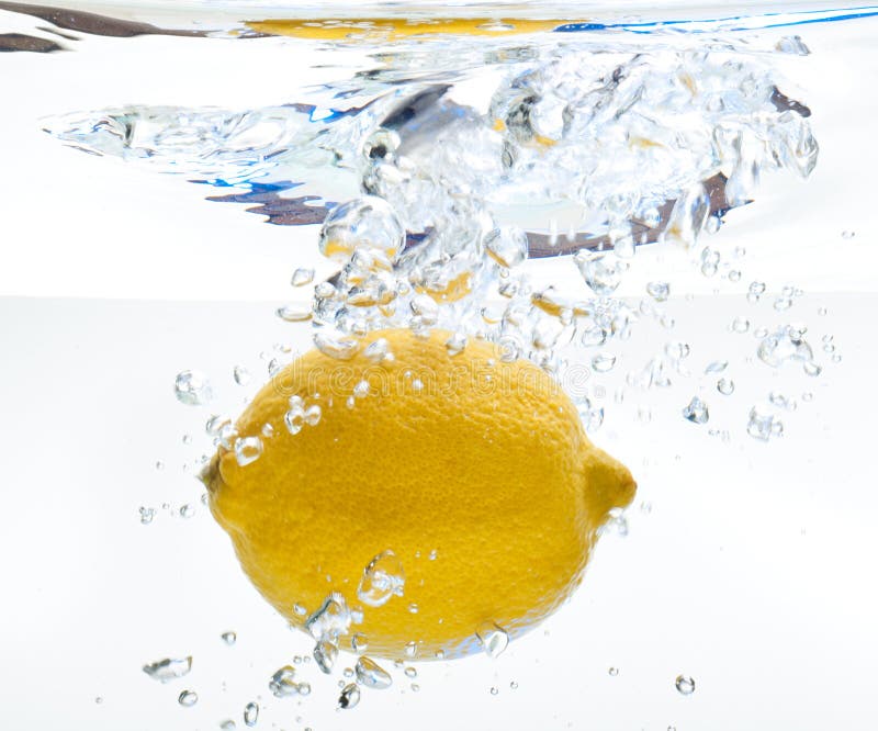 Lemon in the water stock image. Image of health, droplet - 23635807