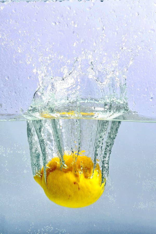 Lemon in water stock photo. Image of refreshment, citrus - 57519136
