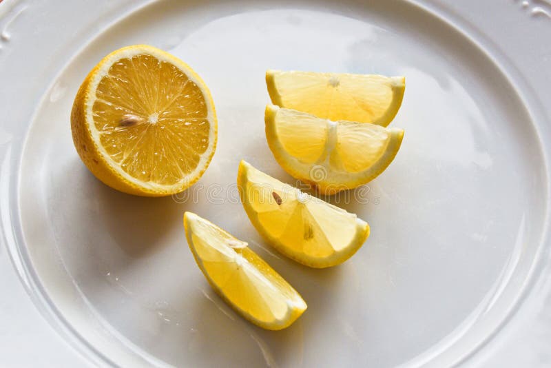 Lemon Wedges on the White Rural Plate Stock Image - Image of lemon ...