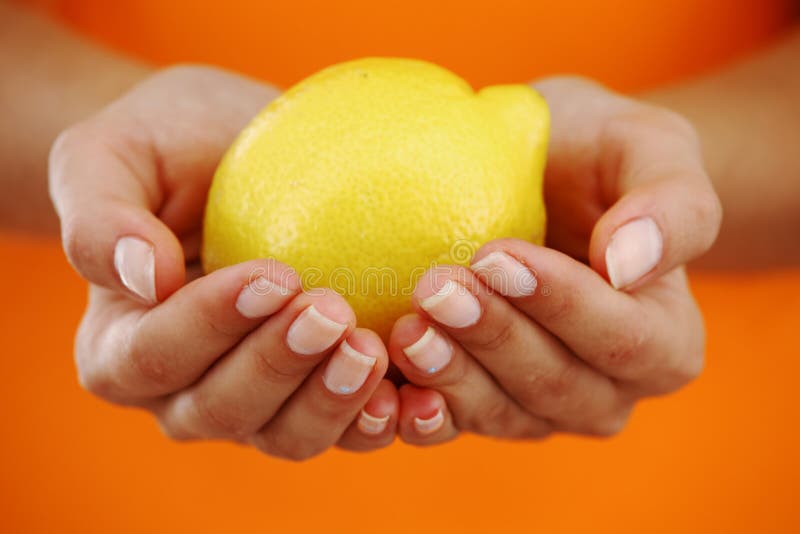 Lemon in woman hands stock image. Image of finger, healthy - 17870357