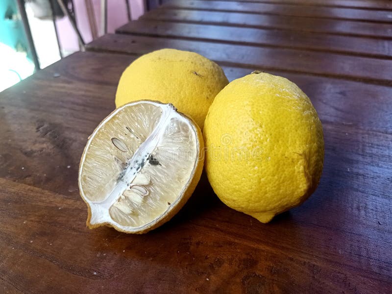 Lemon in the wood table stock image. Image of lemonade - 362859573