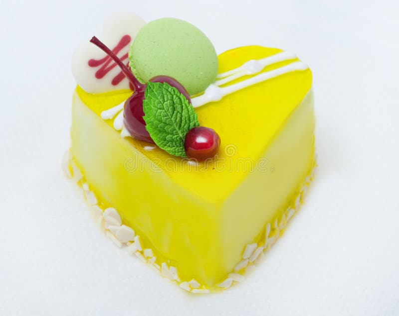 Lemon Yellow Heart Cake with Cherries and Cream on White Background ...