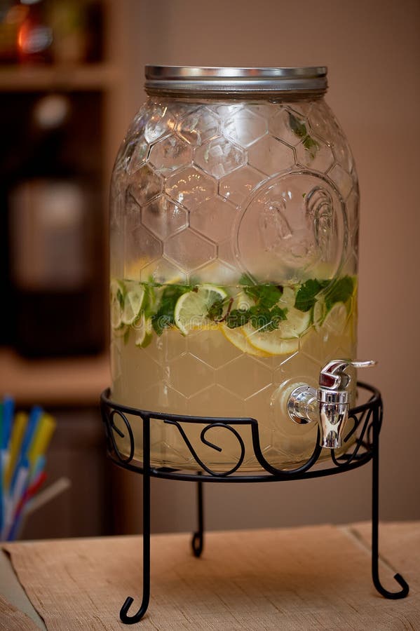 Lemonade in a Big Jar with a Tap.Oranges and Lemon. Refreshing Summer ...