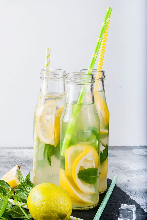 Lemonade in Bottles with Ice and Mint Stock Image - Image of ingredient ...