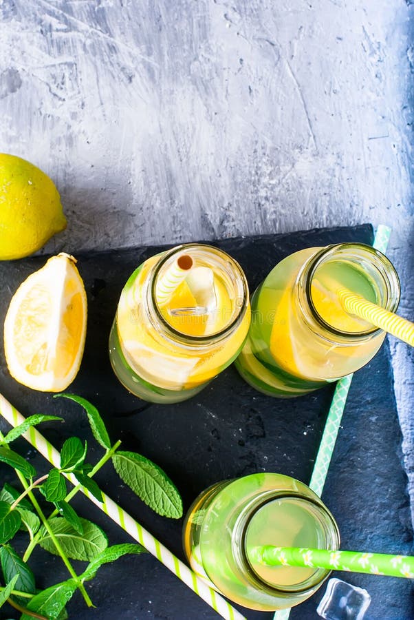 Lemonade in Bottles with Ice and Mint Stock Image - Image of fruit ...