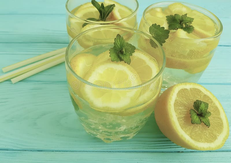 Lemonade with Fresh Lemon and Mint on Blue Wooden Stock Photo - Image ...