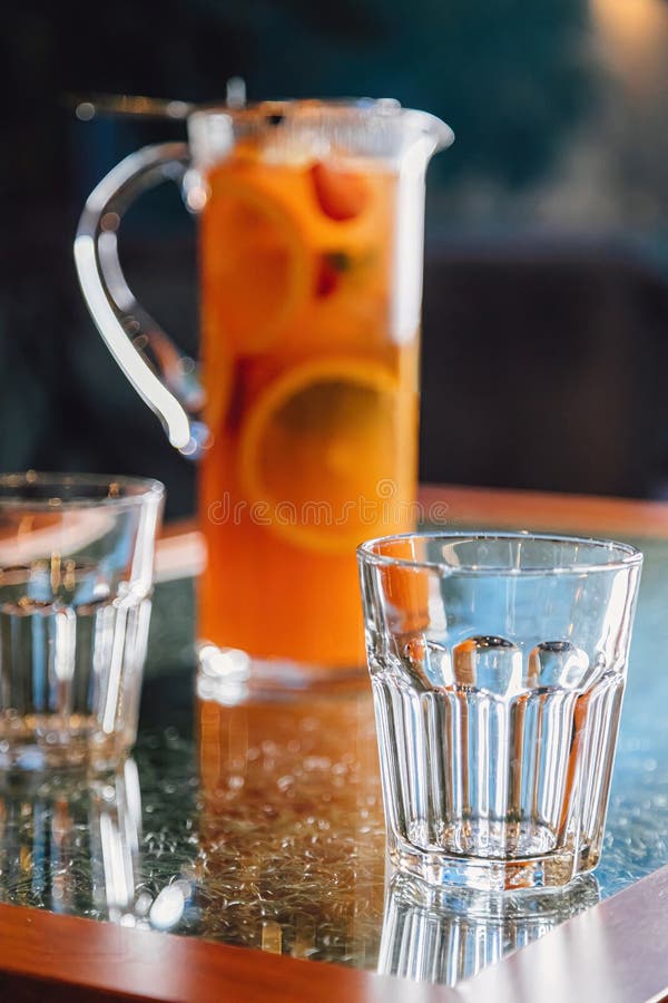 Lemonade from Orange and Berries in Two Modern Glasses in the Form of a ...