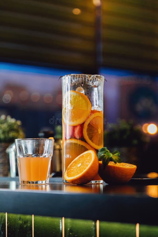 Lemonade from Orange and Berries in Two Modern Glasses in the Form of a ...