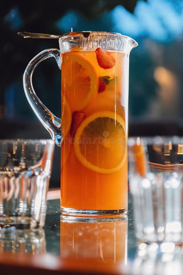 Lemonade from Orange and Berries in Two Modern Glasses in the Form of a ...