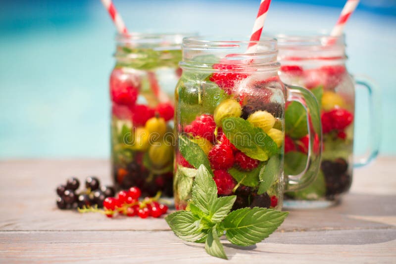 Lemonade with raspberries. stock image. Image of pool - 79960039
