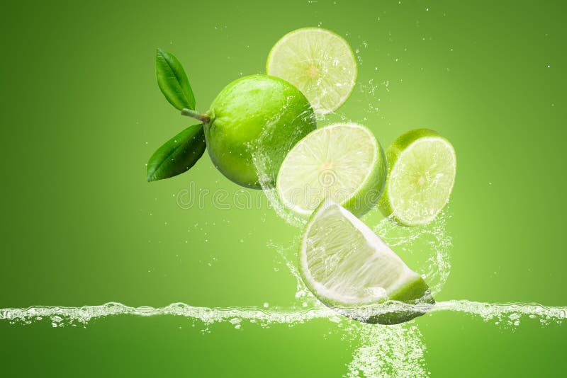 Lemonade Splashing on Green Lemon Fruit Isolated on Green Background ...